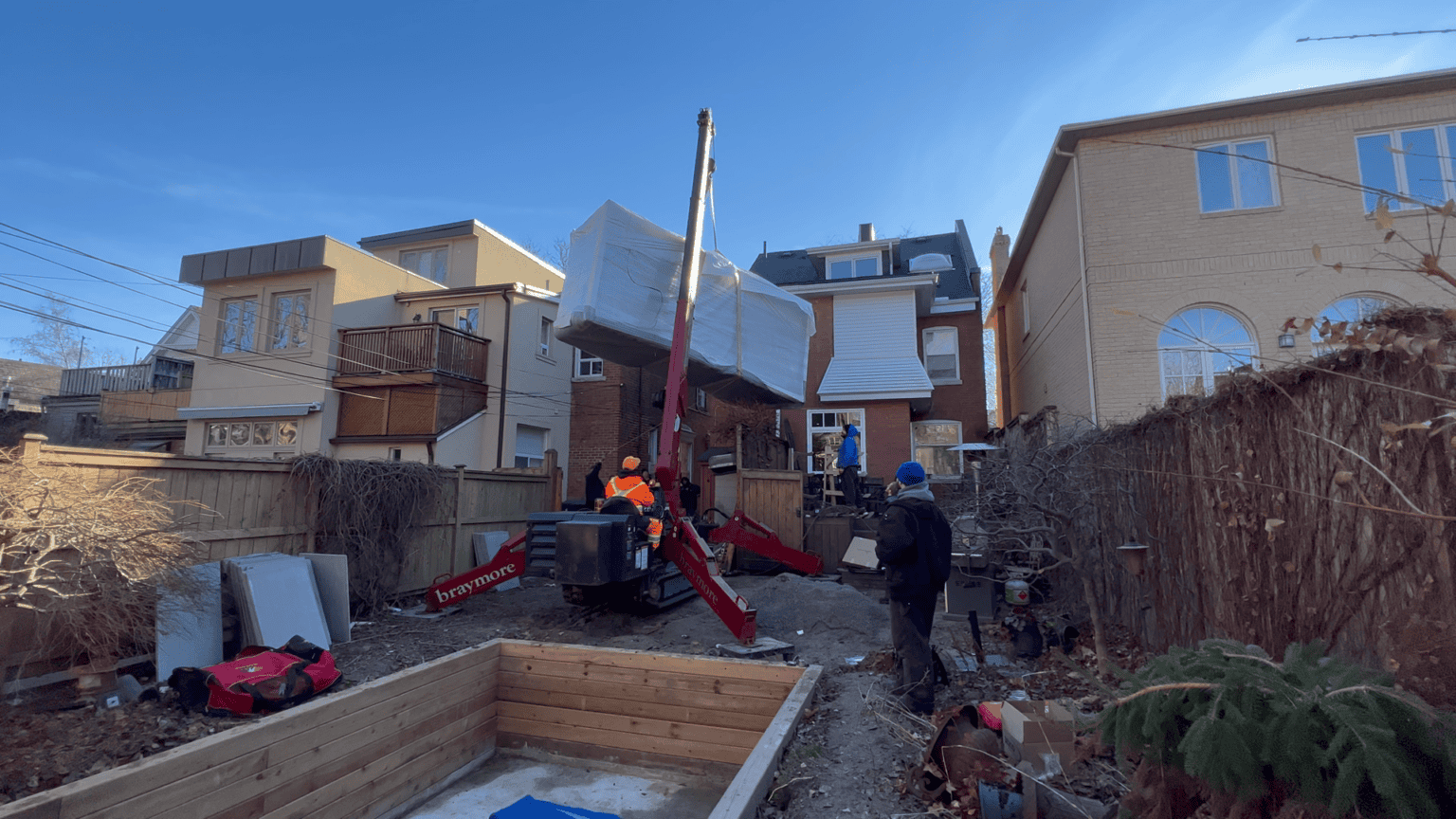 SPYDERCRANE swim spa into pit in Toronto - Braymore Crane Rental